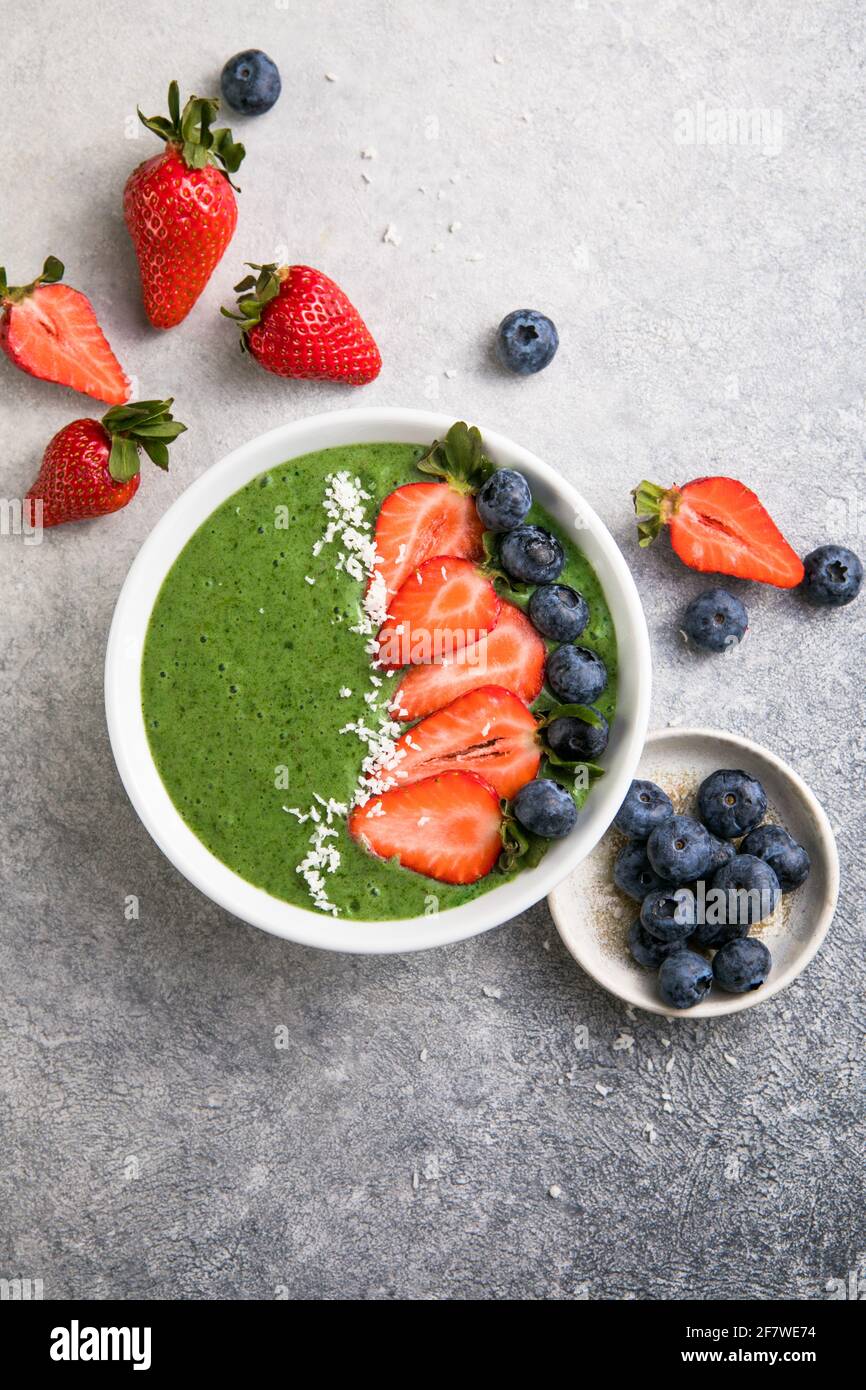 Colorful, healthy food. Acai green smoothie bowl. Keto breakfast idea ...