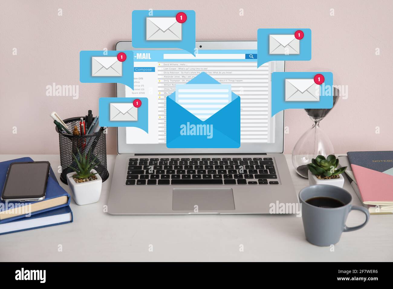 Received email messages on screen of laptop at workplace Stock Photo ...