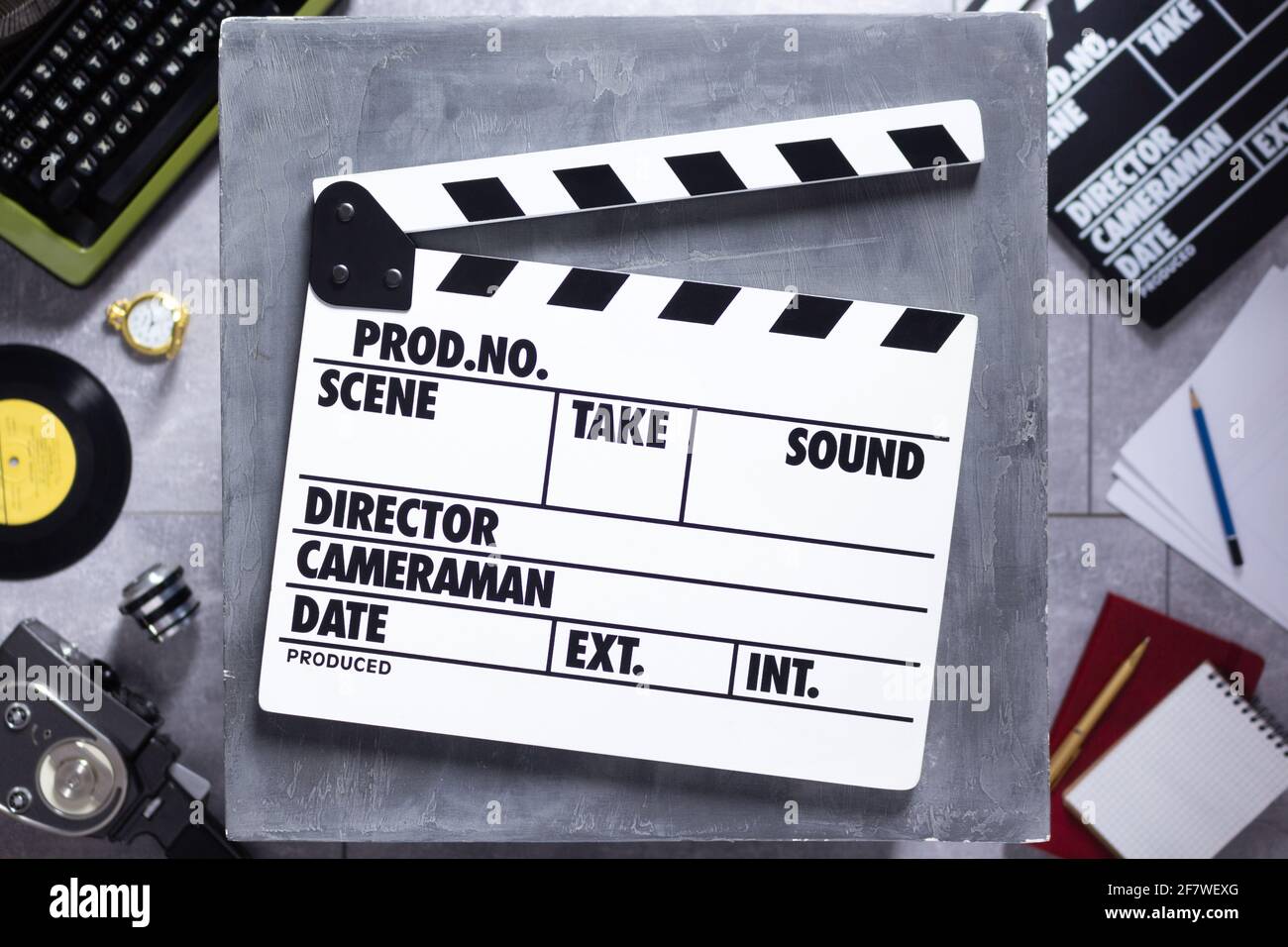 Movie clapboard or clapper at old table. Clapperboard and screenwriter ...