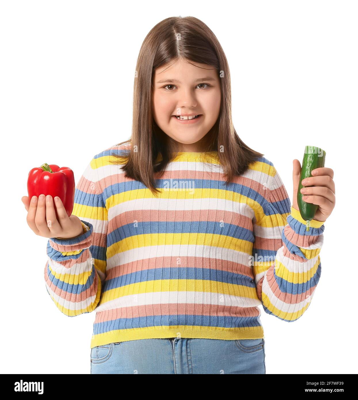 Overweight girl with healthy vegetables on white background Stock Photo ...