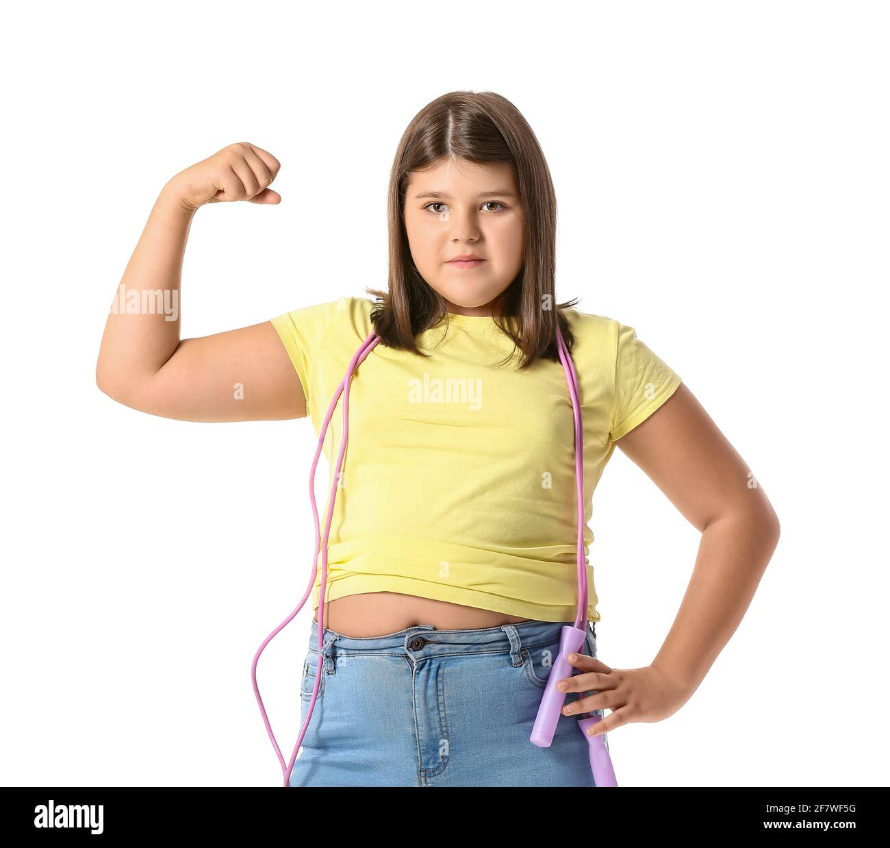 Overweight girl with jumping rope on white background Stock Photo - Alamy
