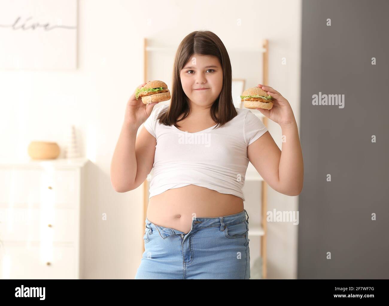 Overweight children eating hi-res stock photography and images - Alamy