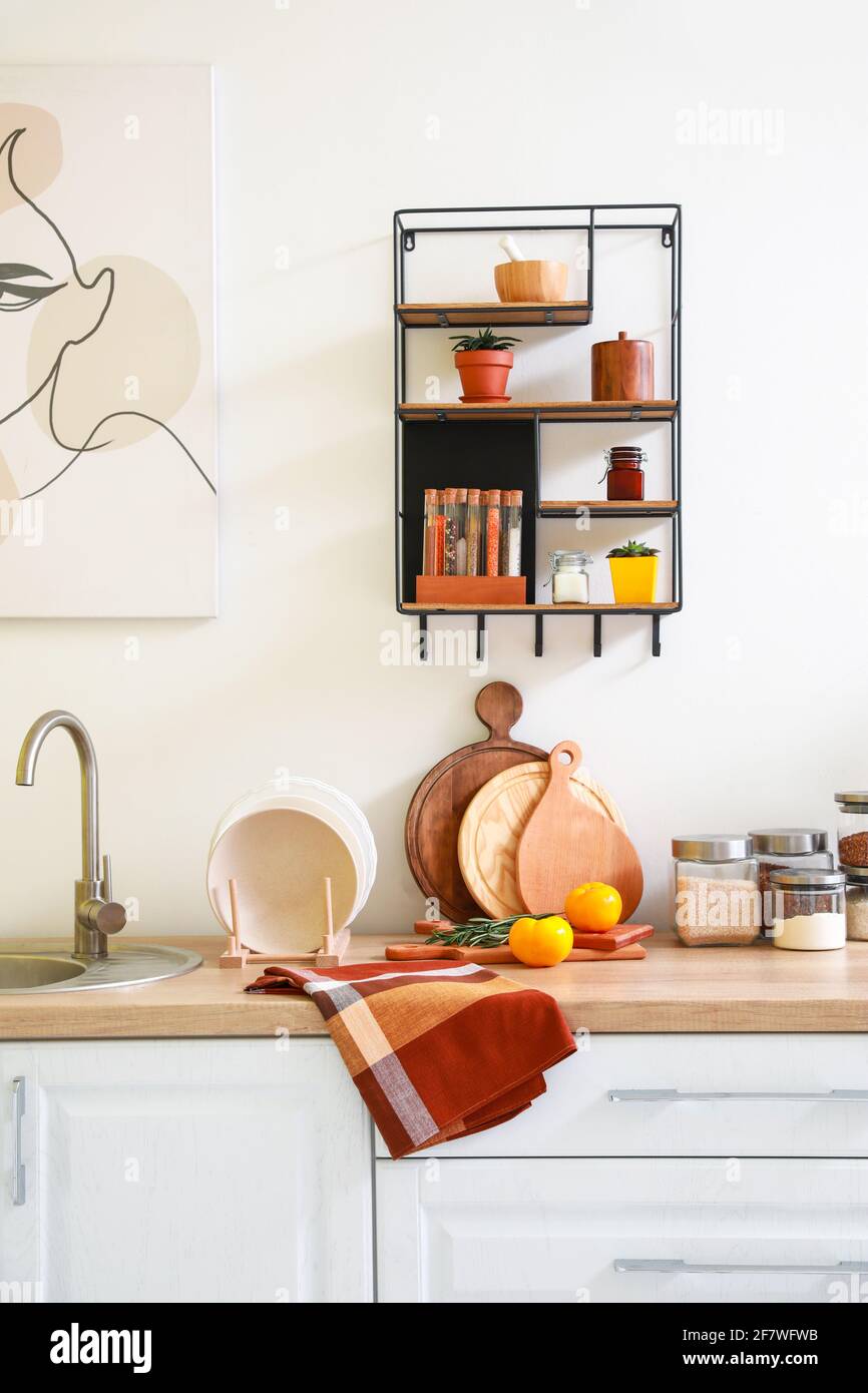 Counter with products and utensils in interior of modern kitchen Stock ...