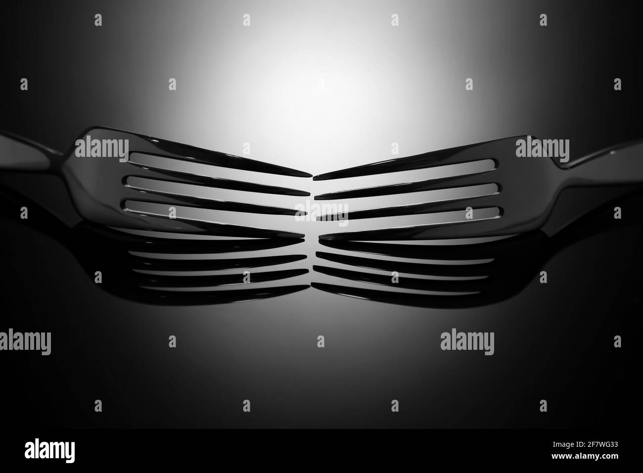 Creative composition with stylish forks on dark background Stock Photo ...