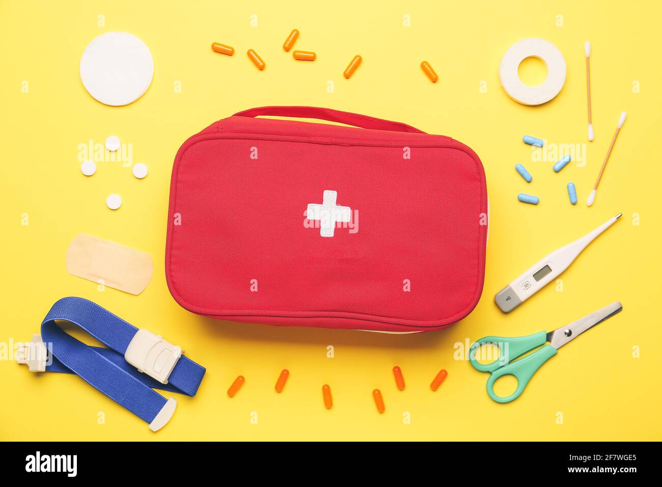First aid kit on color background Stock Photo - Alamy