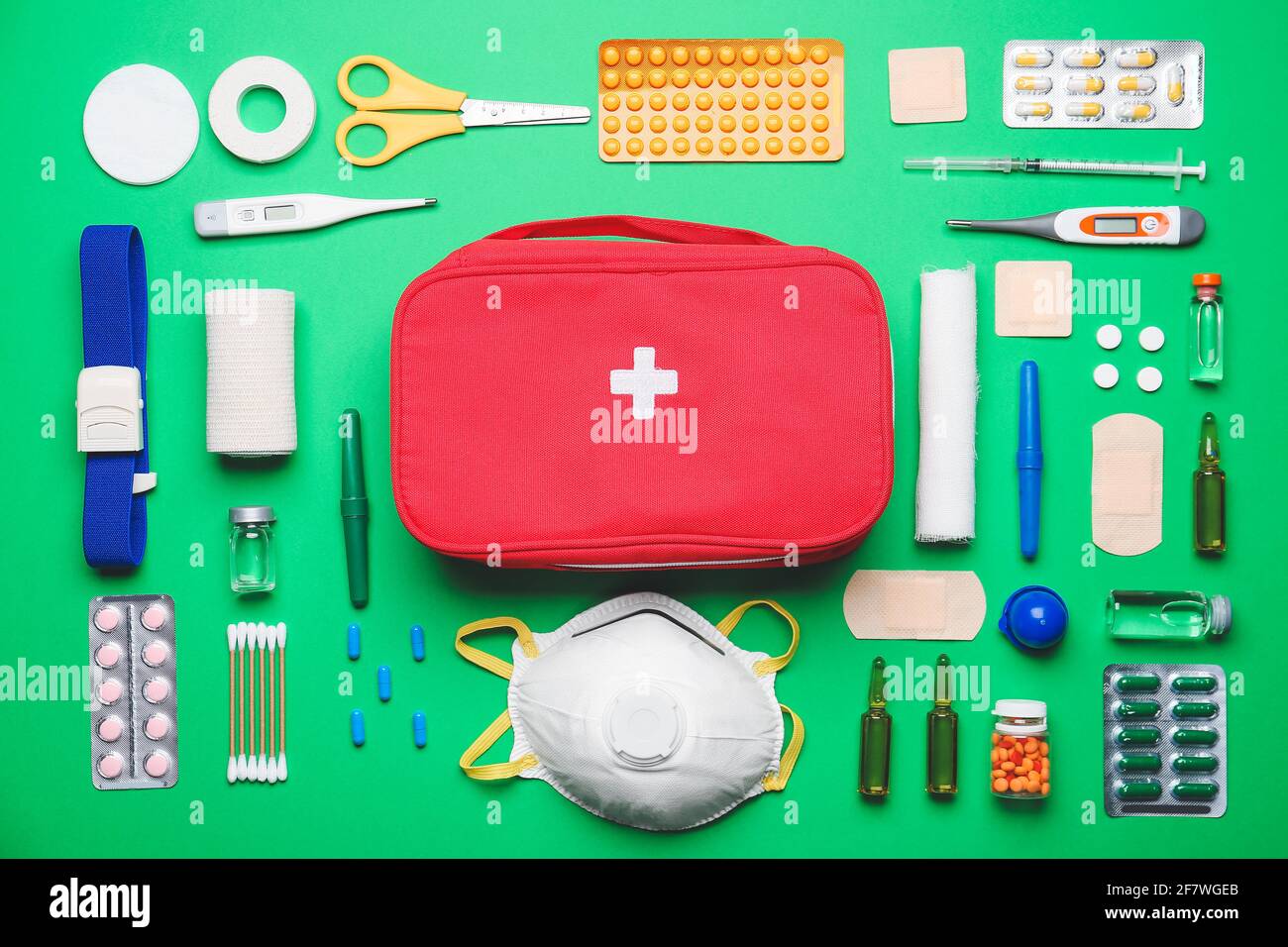 First aid kit on color background Stock Photo - Alamy