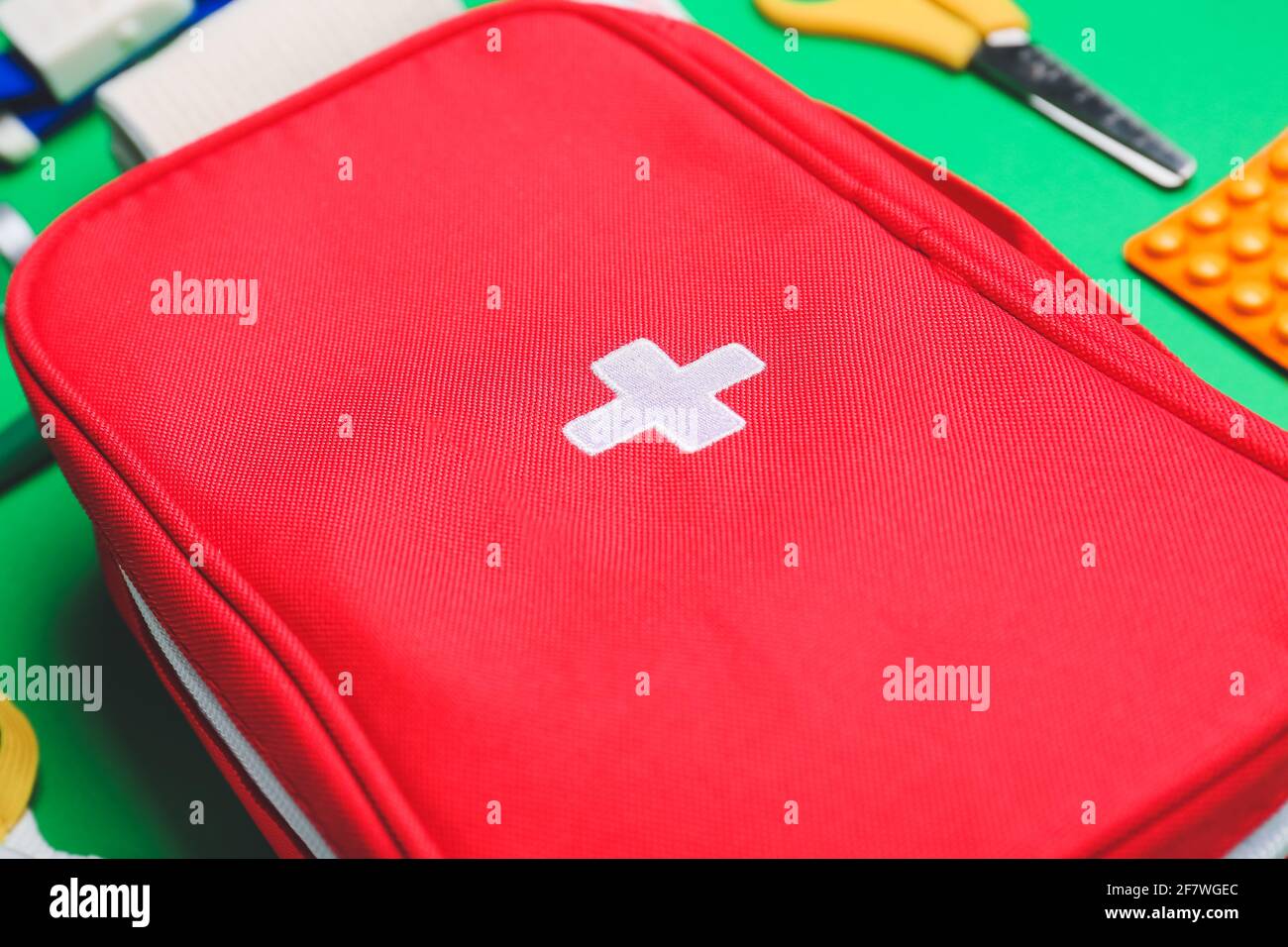 First aid kit on color background Stock Photo - Alamy