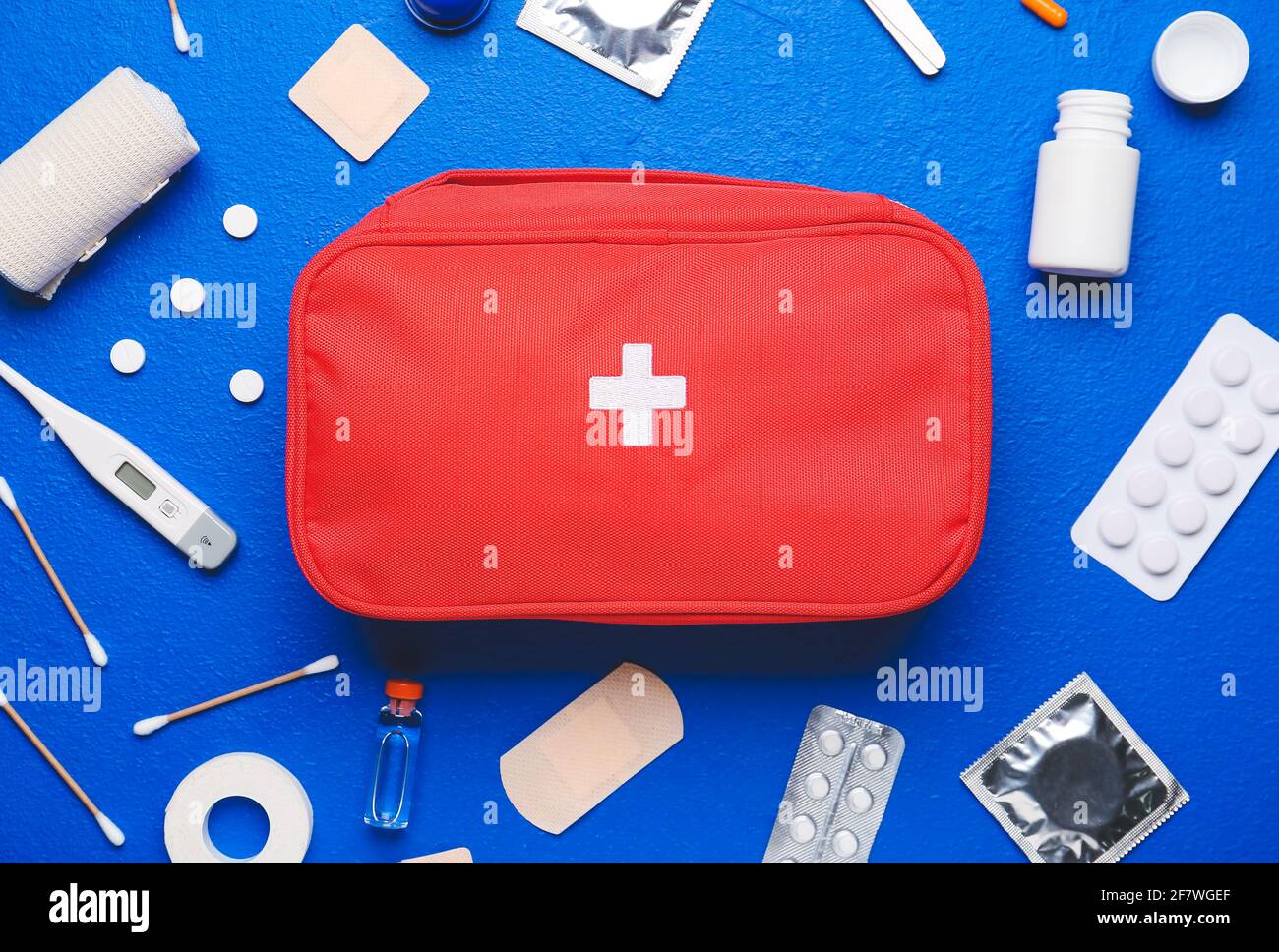 First aid kit on color background Stock Photo - Alamy