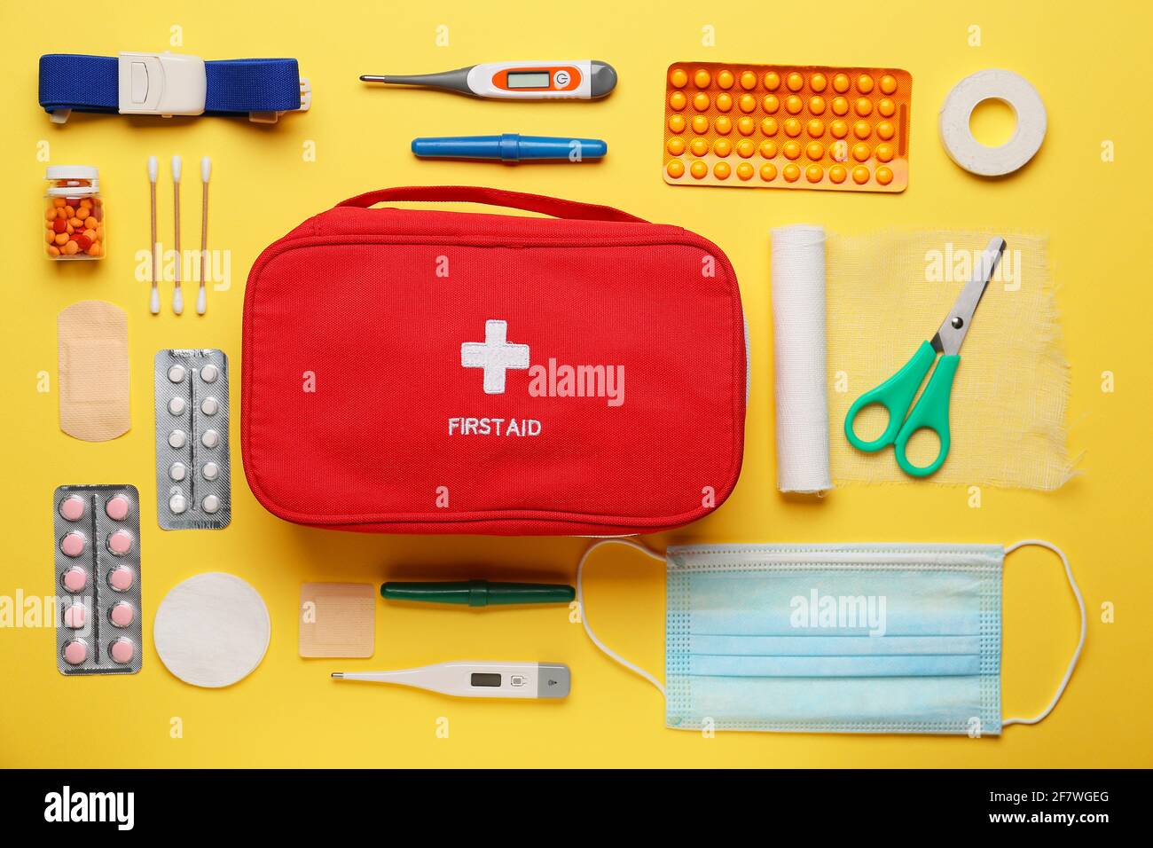 First aid kit on color background Stock Photo - Alamy