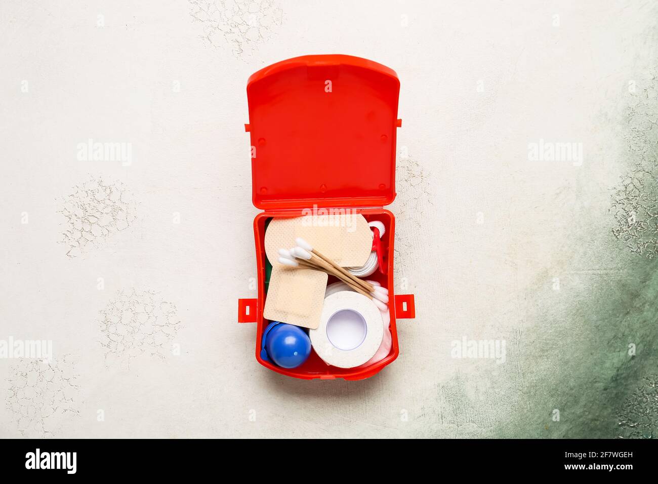 First aid kit on light background Stock Photo - Alamy