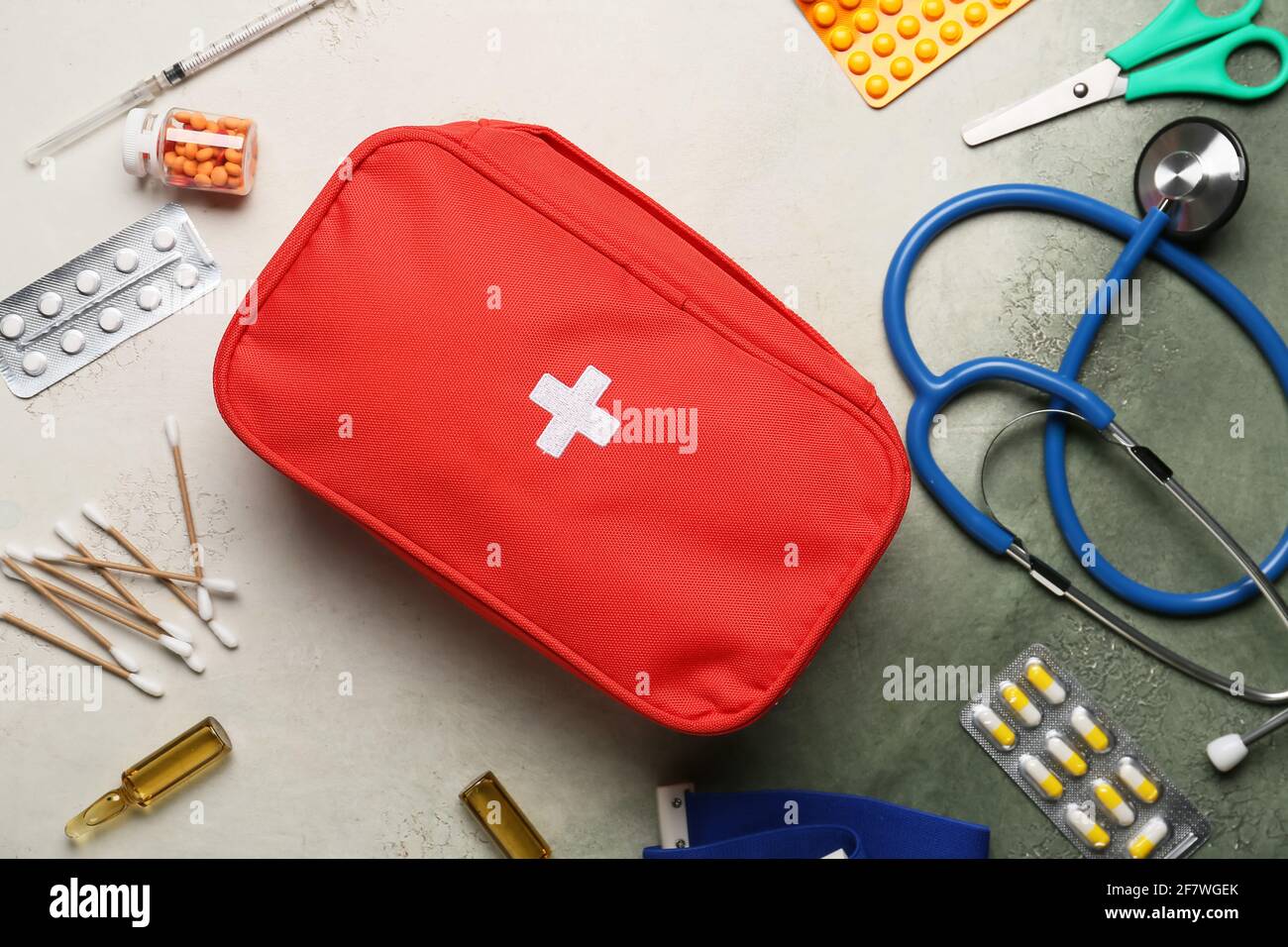 First aid kit on light background Stock Photo - Alamy