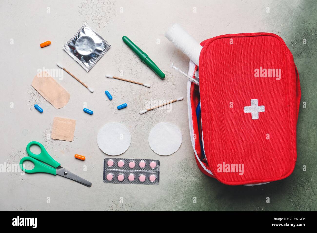 First aid kit on light background Stock Photo - Alamy