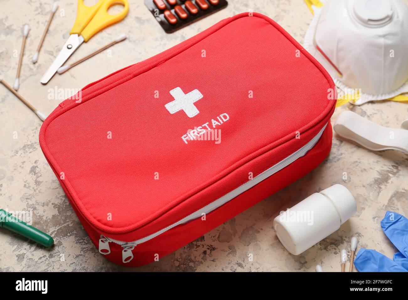 First aid kit on grunge background Stock Photo - Alamy