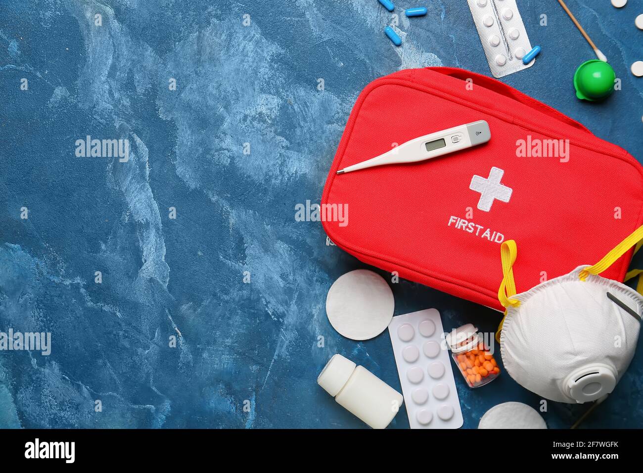 First aid kit on color background Stock Photo - Alamy