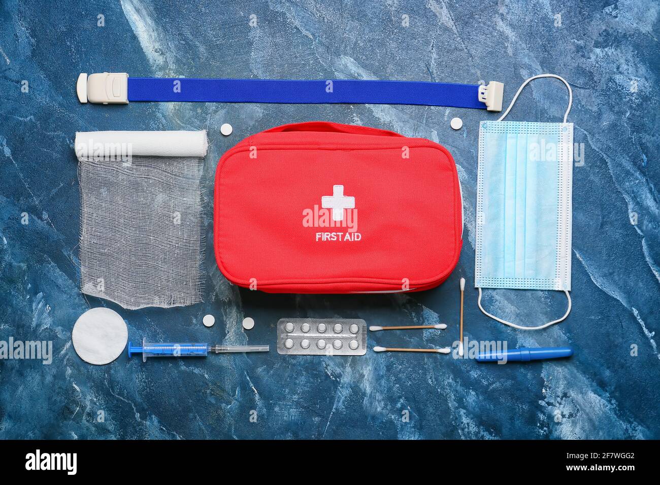 First aid kit on color background Stock Photo - Alamy