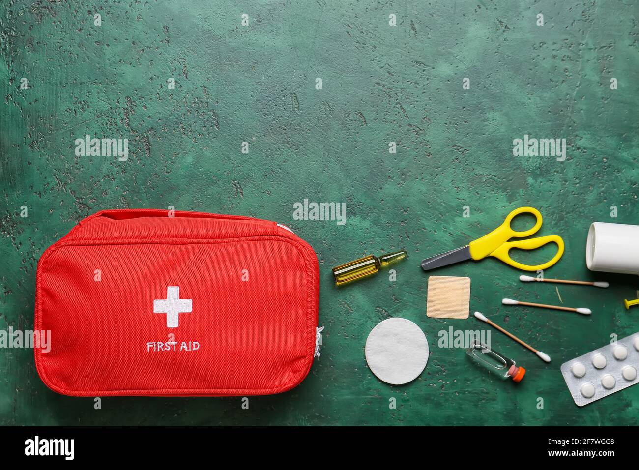 First aid kit on color background Stock Photo - Alamy