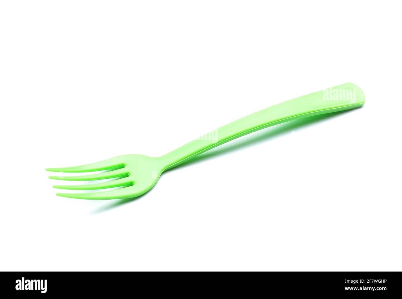 Plastic fork on white background Stock Photo - Alamy