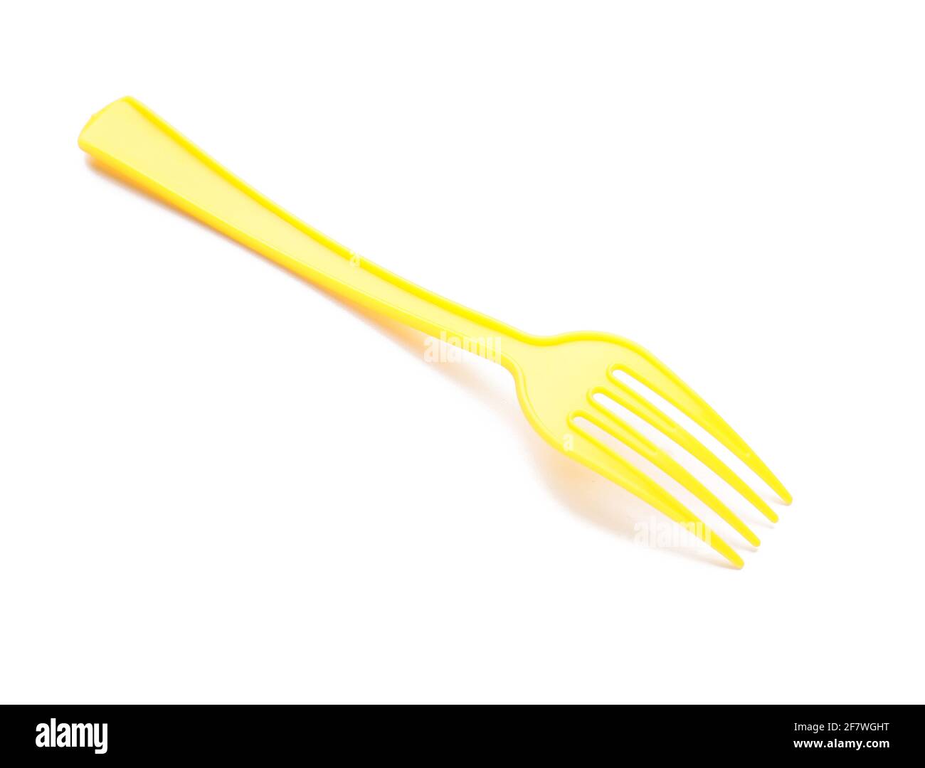 Plastic fork on white background Stock Photo - Alamy