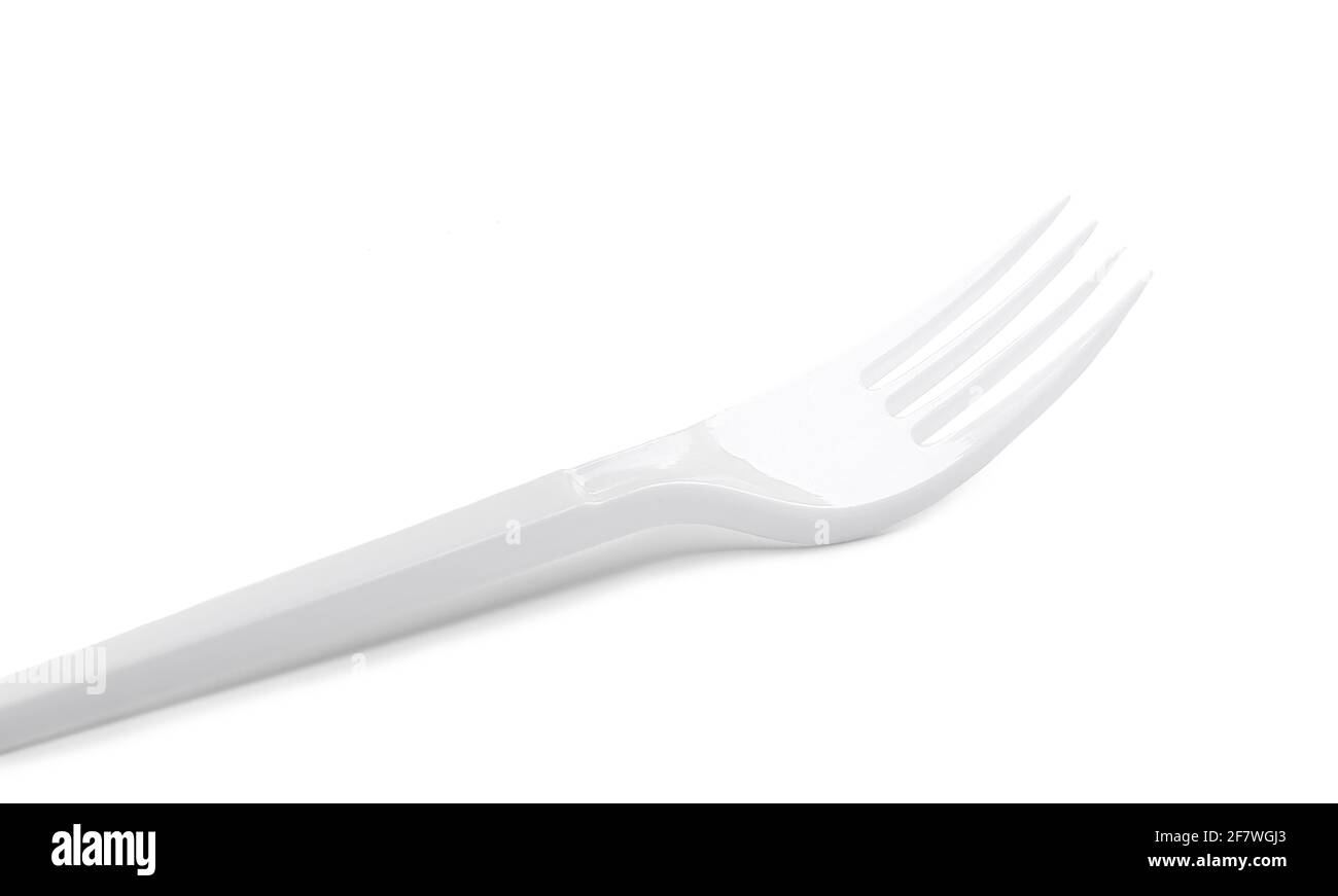 Plastic fork on white background Stock Photo - Alamy