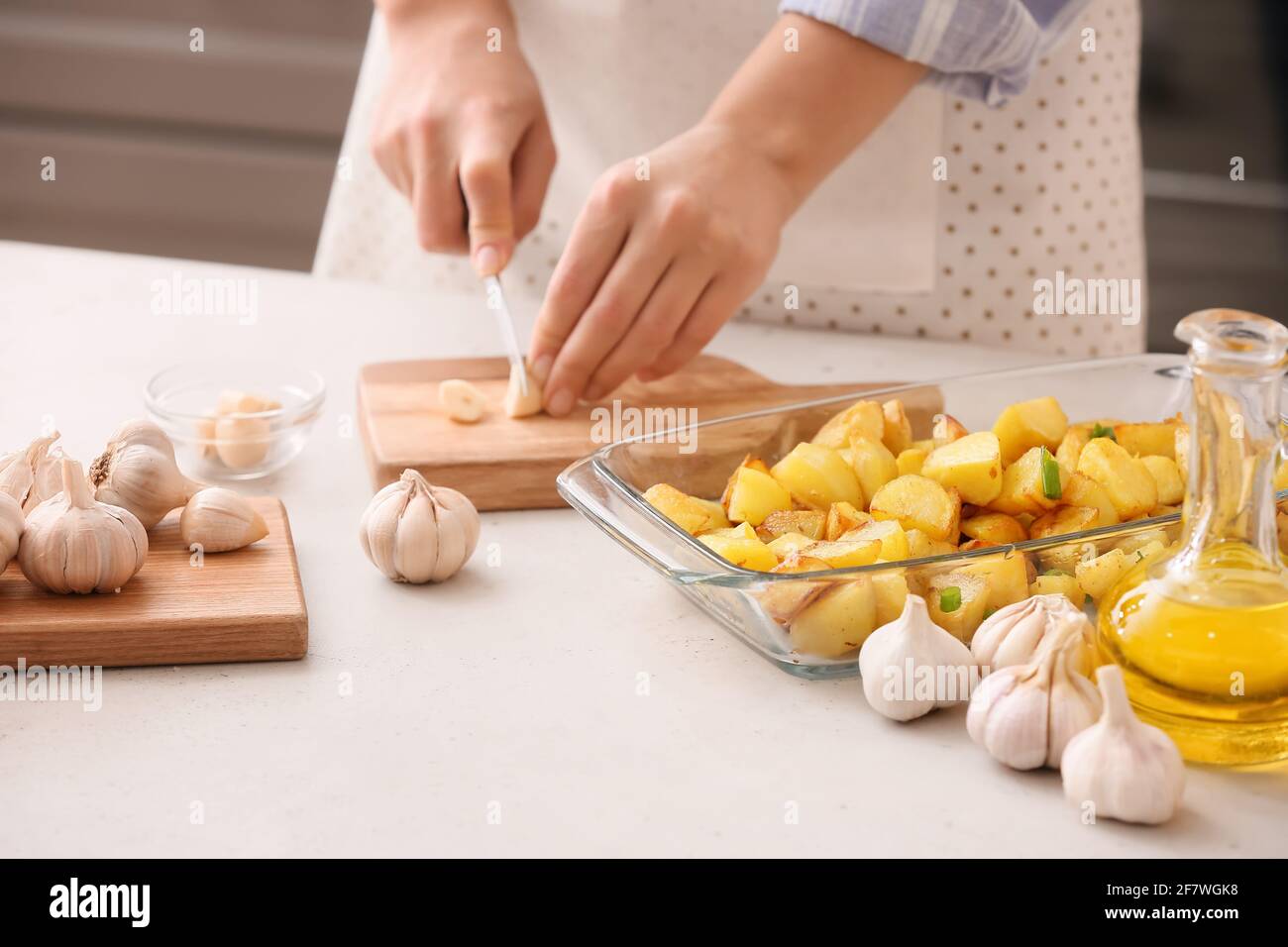 Female hands putting garlic on hi-res stock photography and images - Alamy