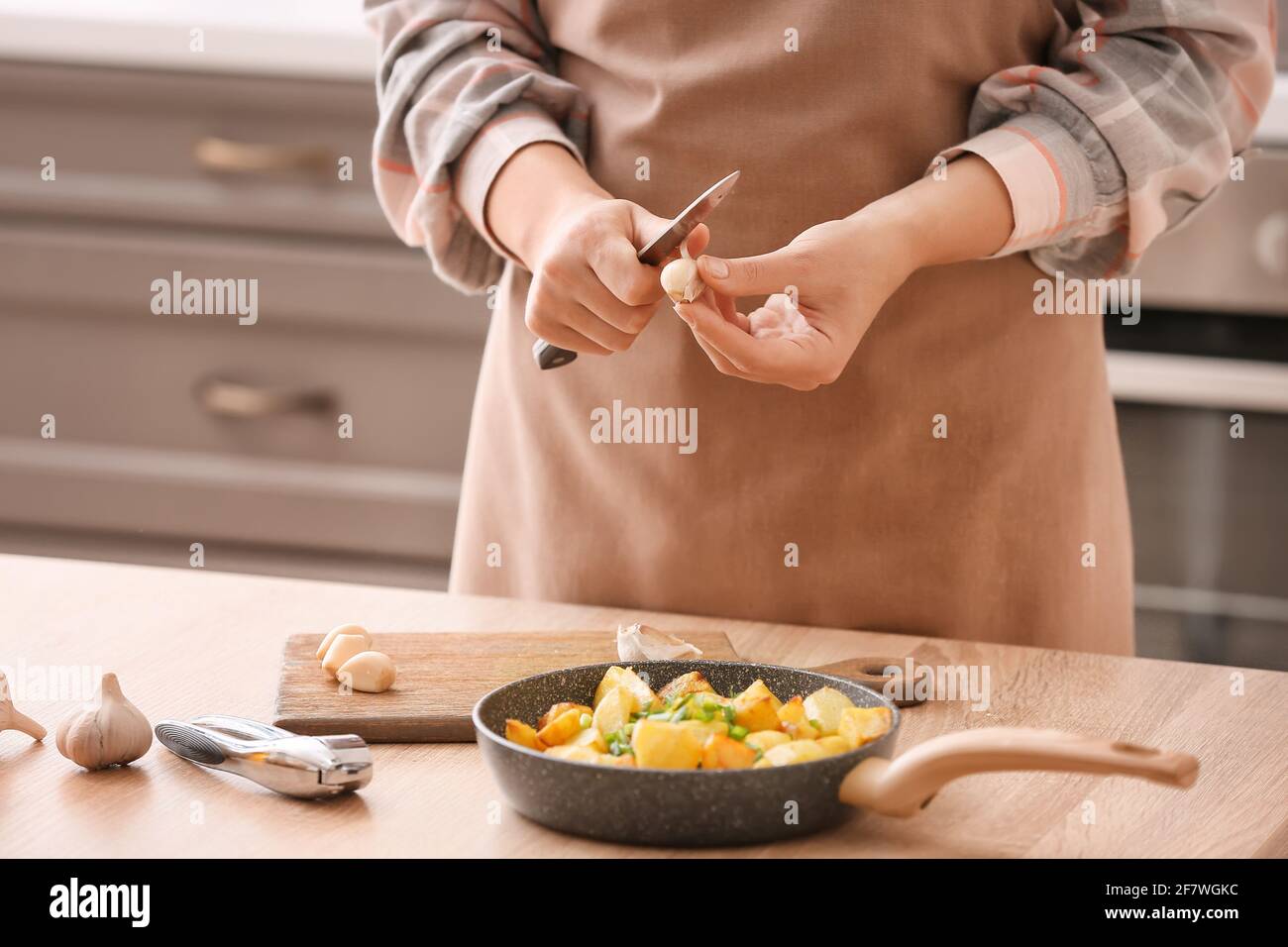 Woman peeling onion in hi-res stock photography and images - Alamy