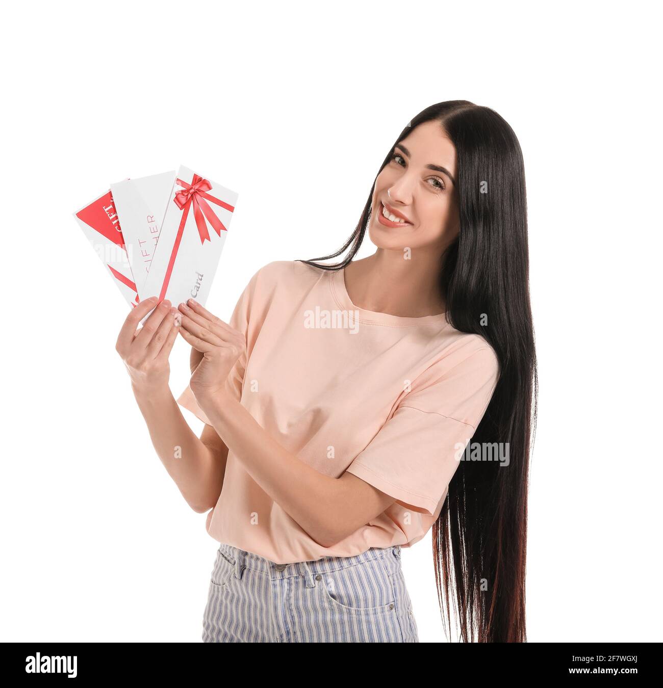Beautiful young woman with gift cards on white background Stock Photo ...