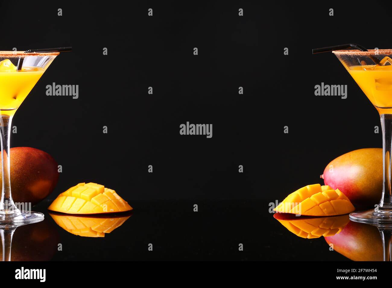 Glasses of tasty mango margarita on dark background Stock Photo - Alamy