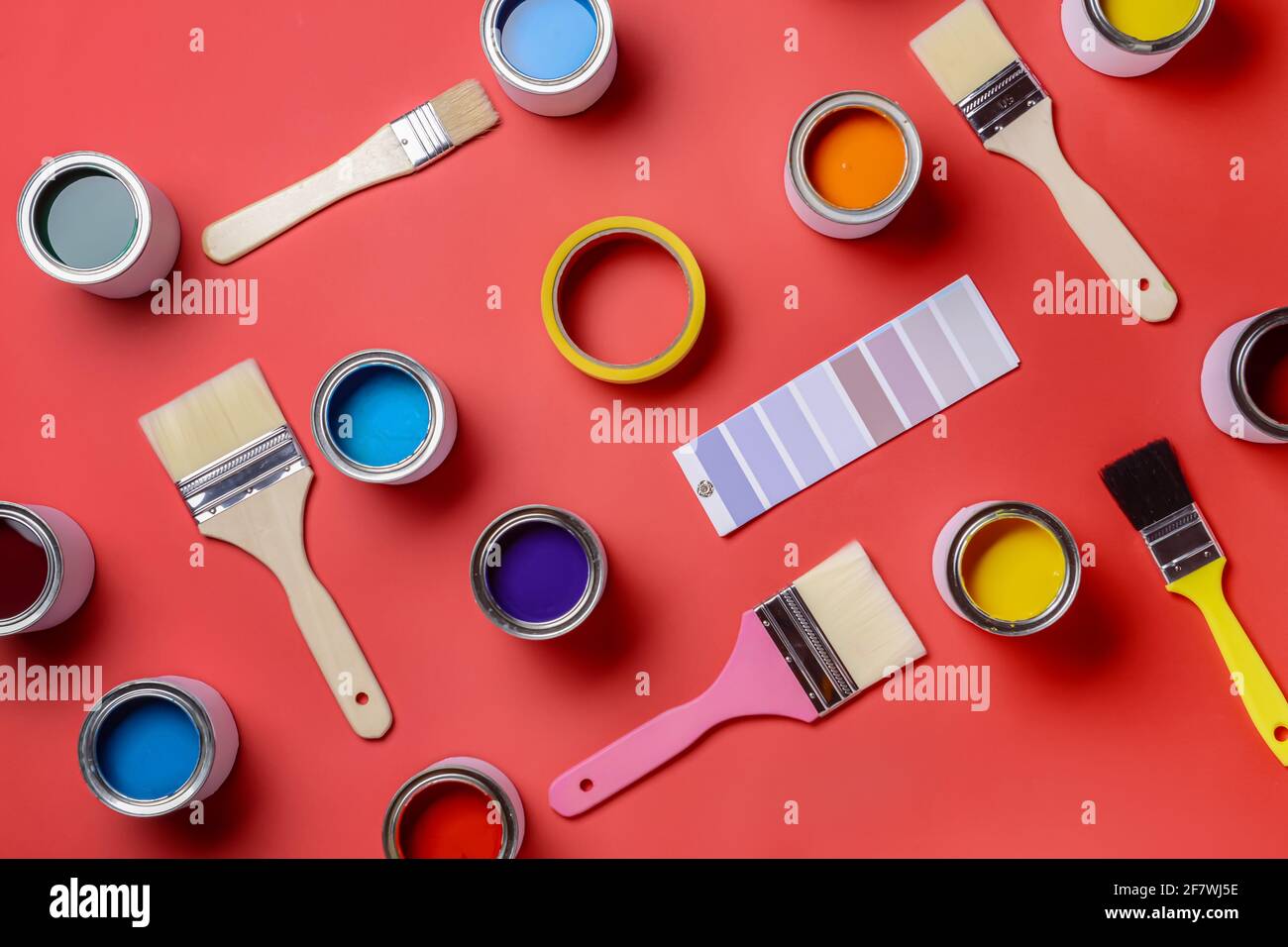 Cans of paints, palette sample and brushes on color background Stock ...