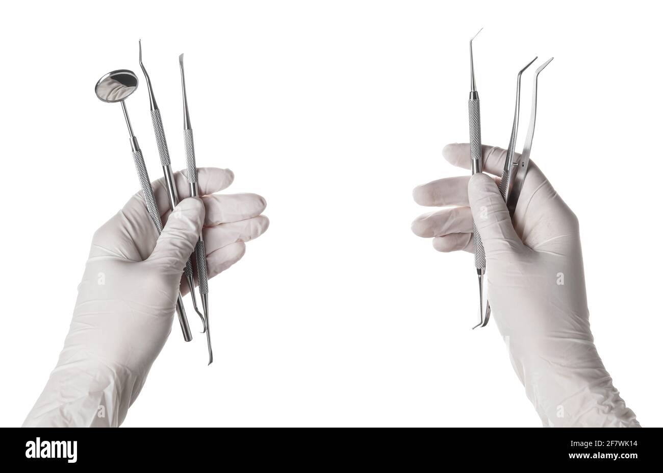 Dentist with instruments on white background Stock Photo - Alamy