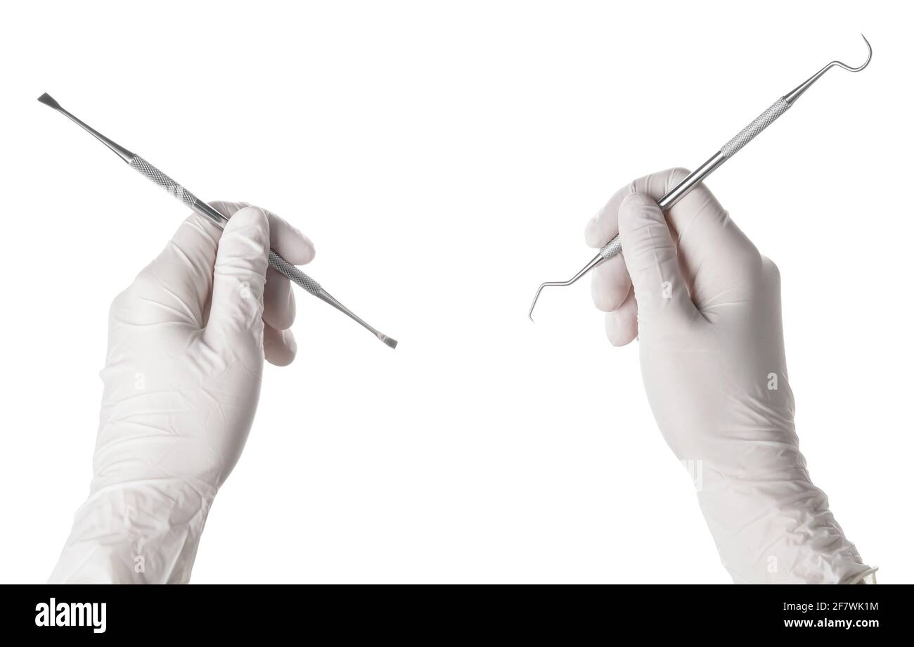 Dentist with instruments on white background Stock Photo - Alamy