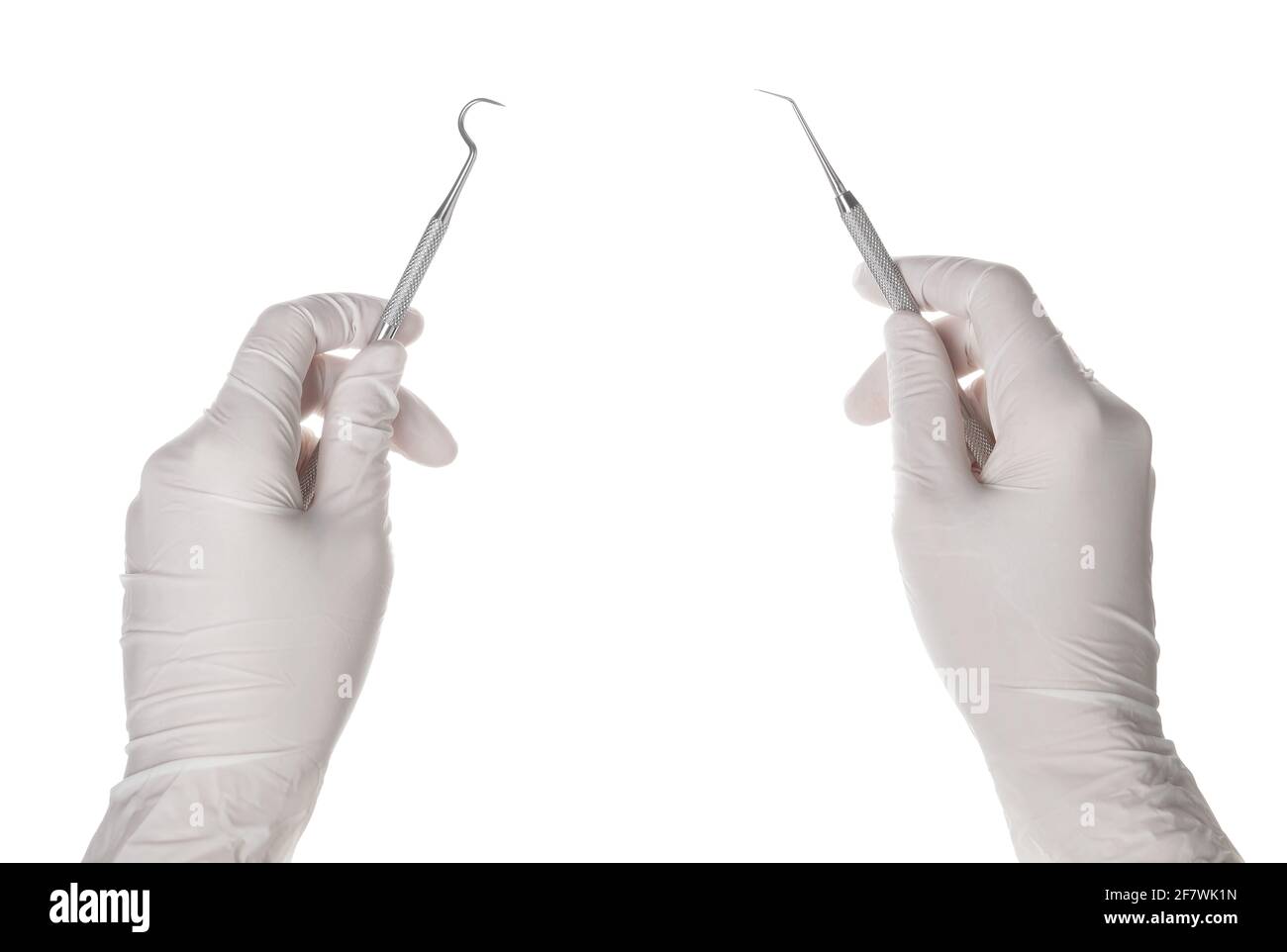 Dentist with instruments on white background Stock Photo - Alamy