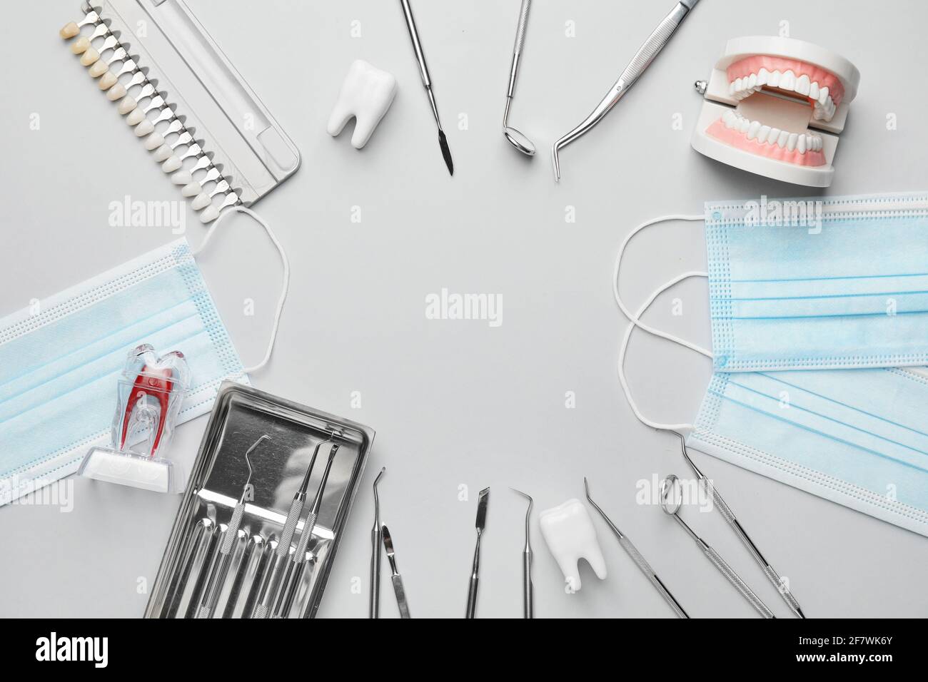 Frame made of dentist's tools, jaw model and teeth color samples on ...