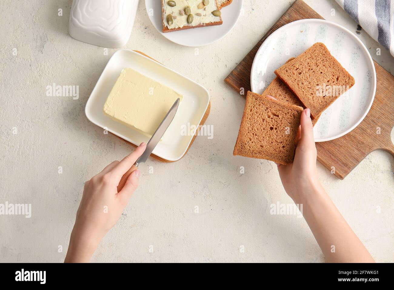 Person spreading butter on top hi-res stock photography and images - Alamy