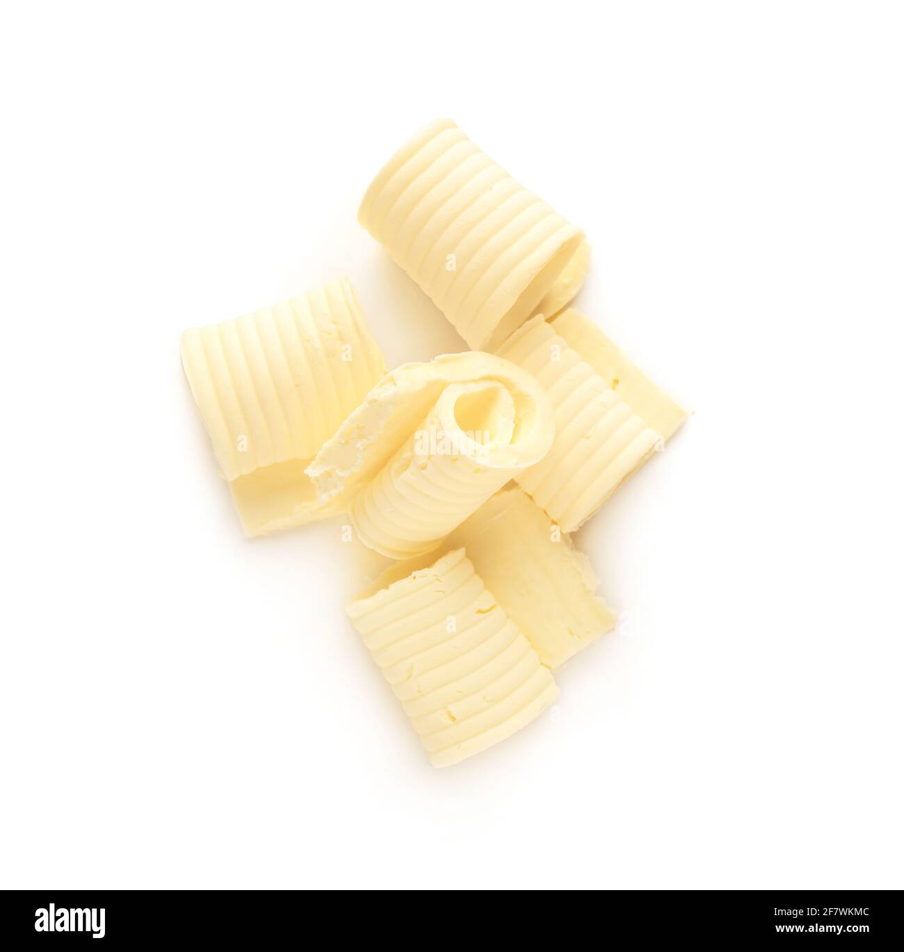 Curls of fresh butter on white background Stock Photo - Alamy