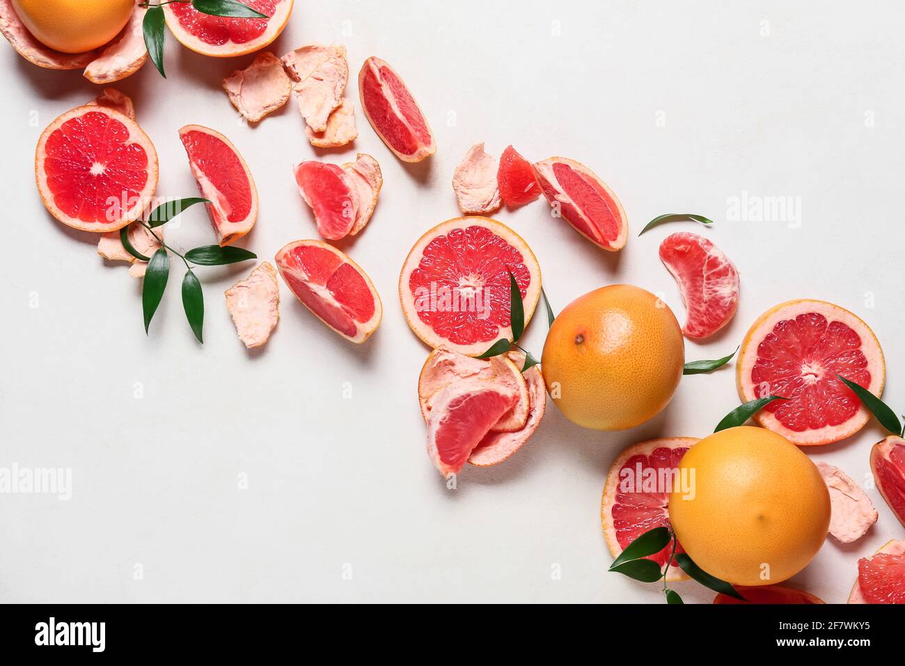 Composition with ripe grapefruits on white background Stock Photo - Alamy