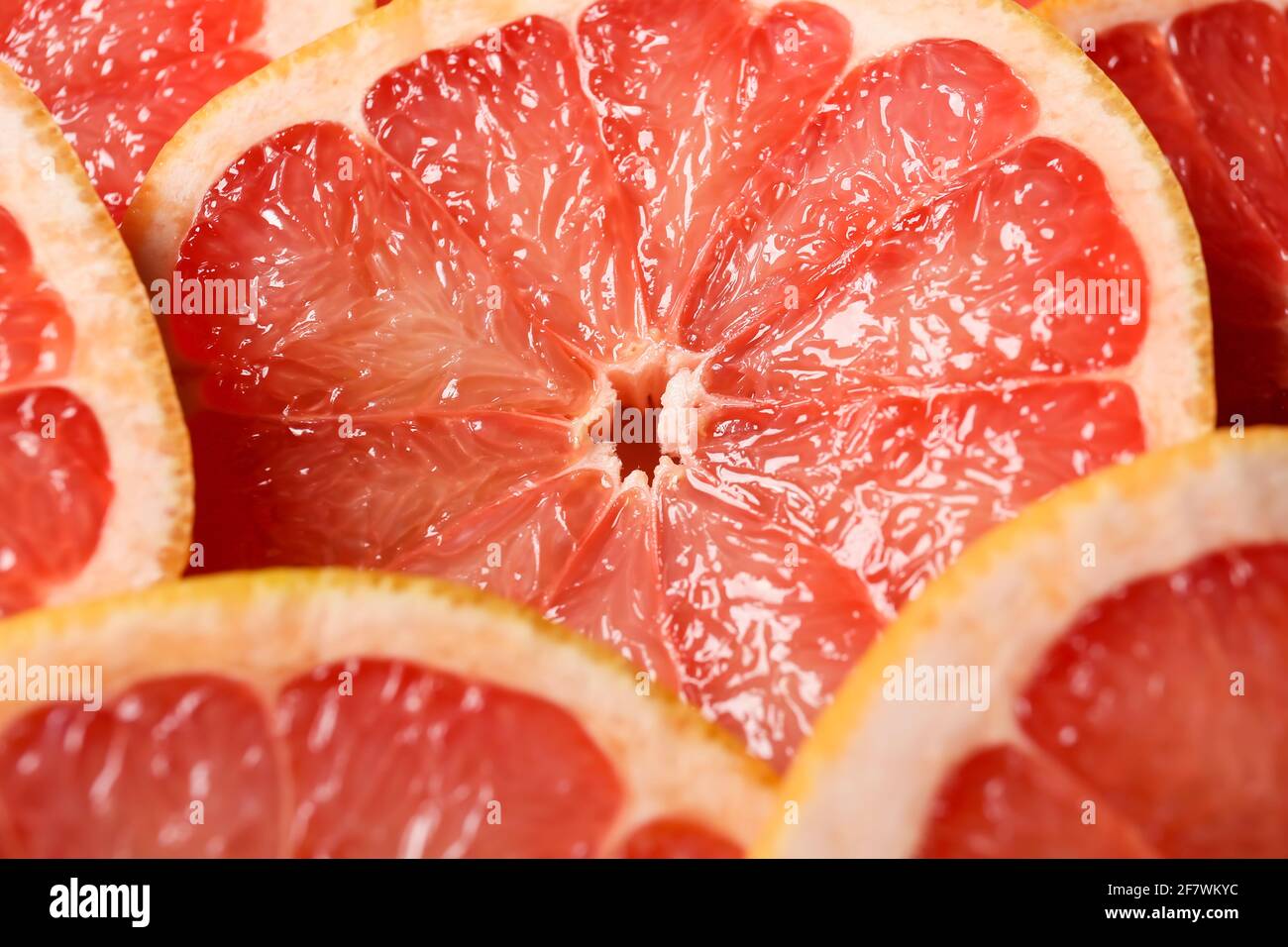 Slices of ripe grapefruits as background, closeup Stock Photo - Alamy