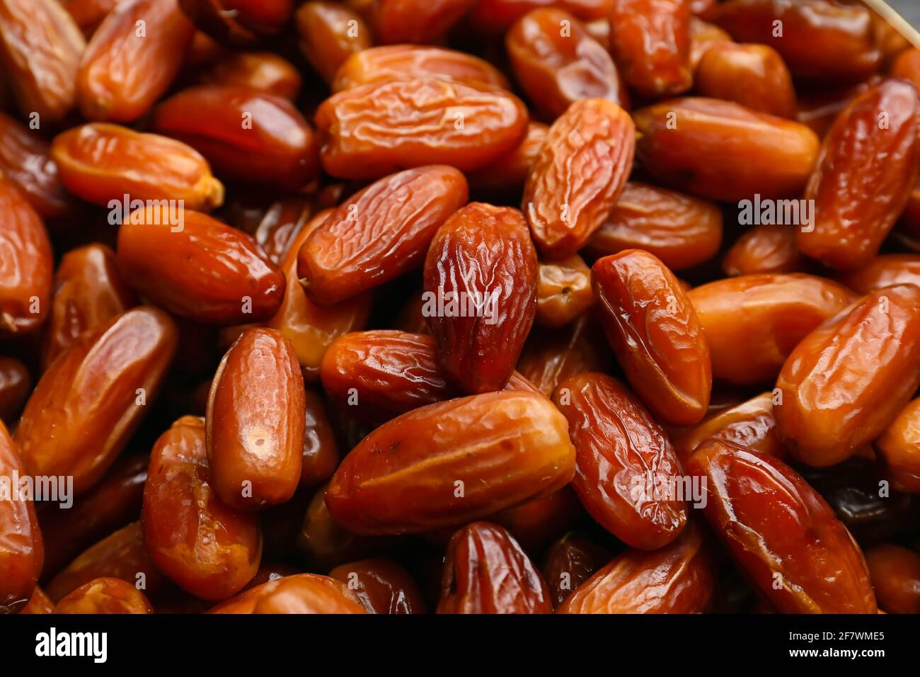 Sweet dried dates as background Stock Photo - Alamy