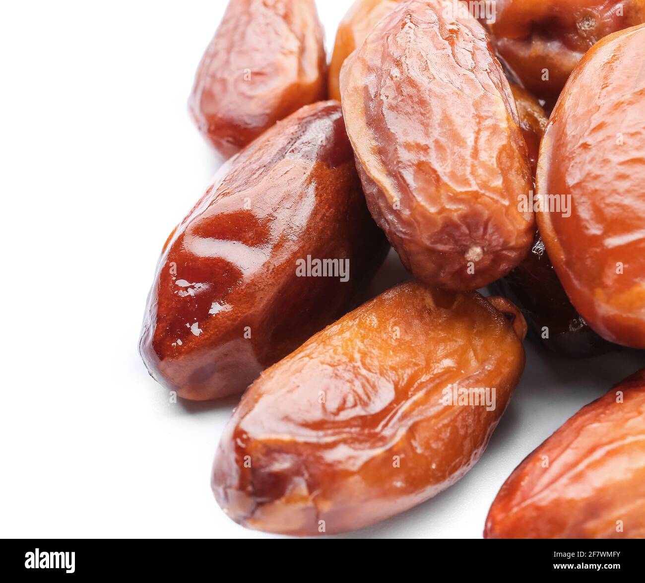 Sweet dried dates on white background Stock Photo - Alamy