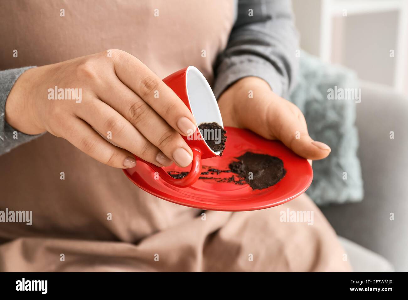Woman reading coffee grounds, closeup Stock Photo - Alamy