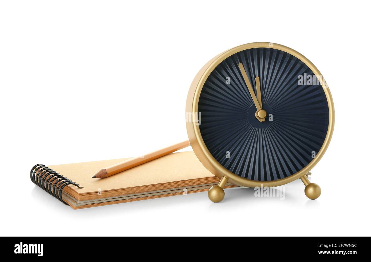 Alarm clock, notebook and pencil on white background Stock Photo - Alamy