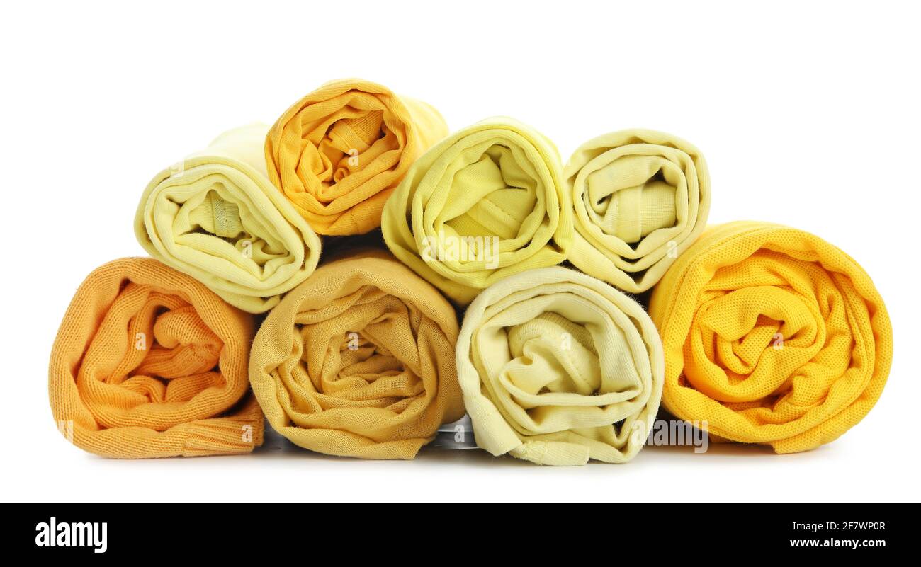 Rolled clean clothes on white background Stock Photo - Alamy