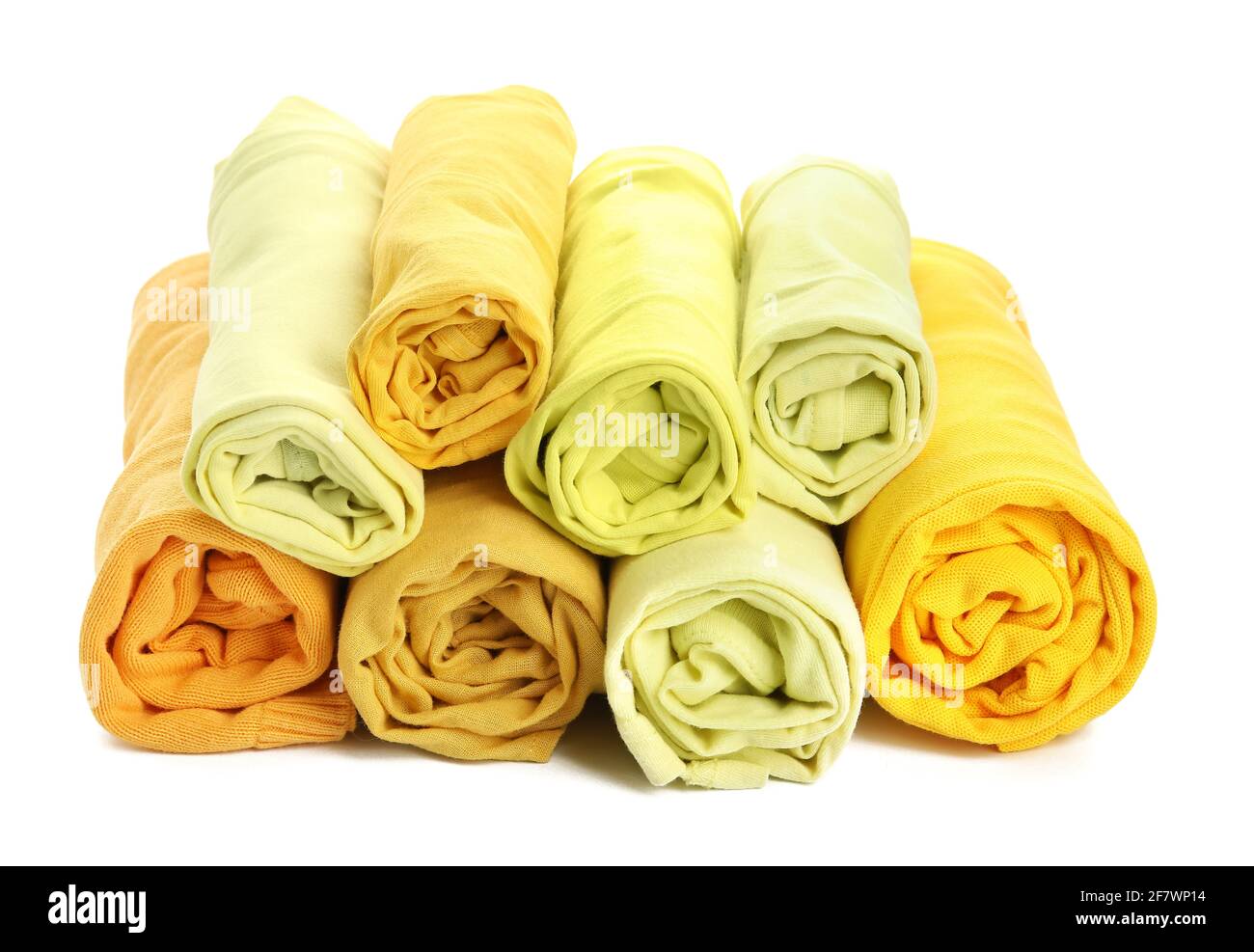 Rolled clean clothes on white background Stock Photo - Alamy