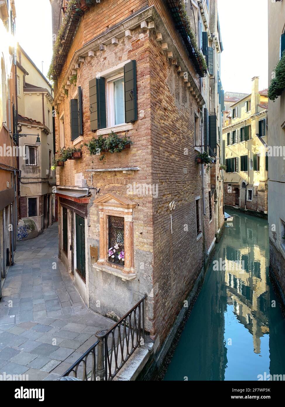 Venice, Italy, February, 13, 2021 - house corner between street and ...