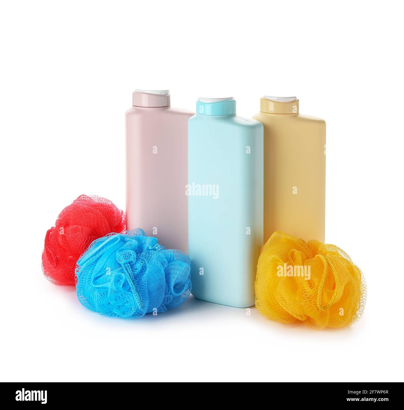 Different bottles of shower gel and sponges on white background Stock ...
