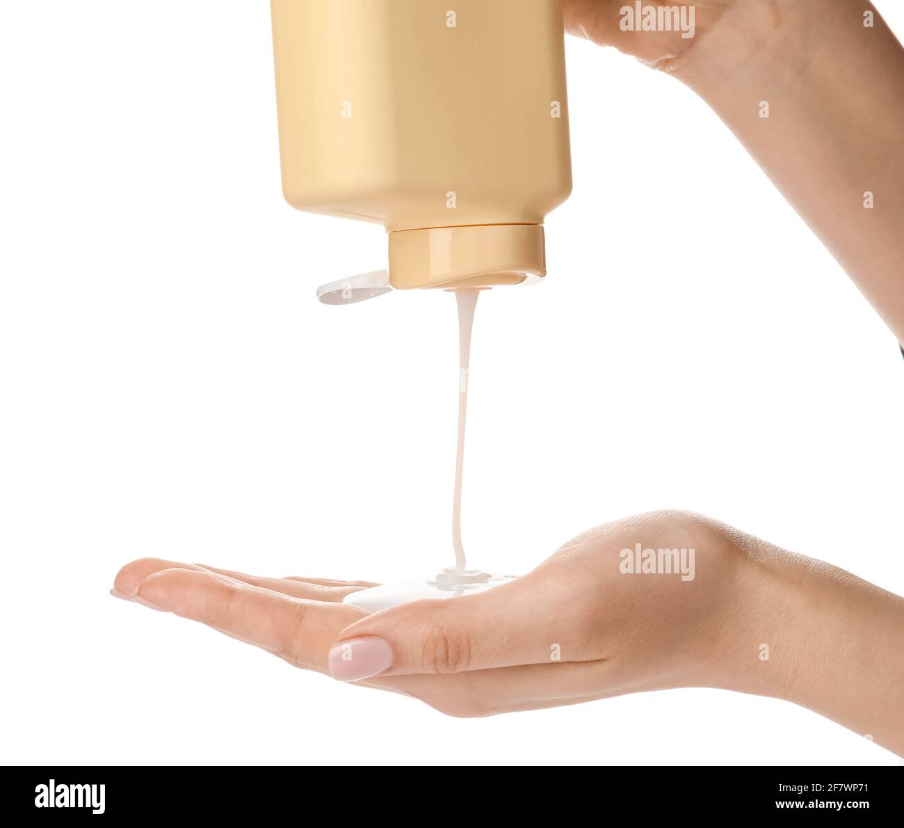Woman pouring shower gel from bottle onto hand on white background ...
