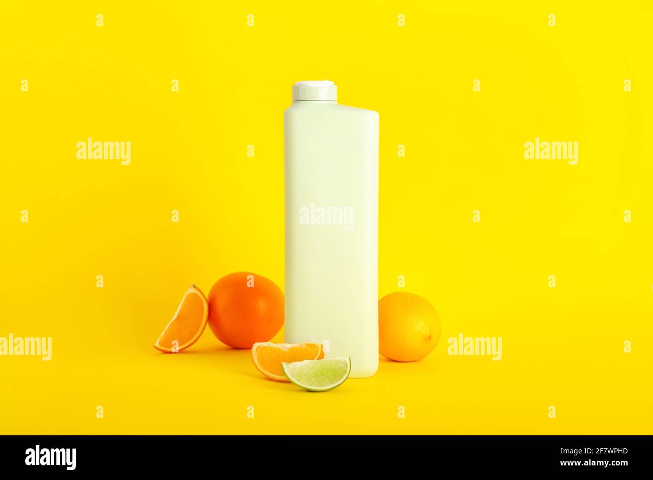 Shower gel and citrus fruits on color background Stock Photo - Alamy