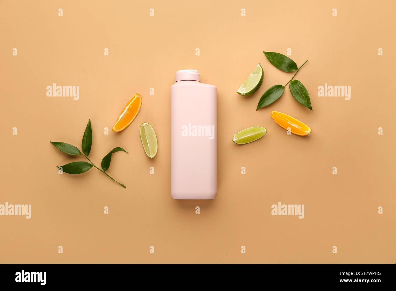Shower gel and citrus fruits on color background Stock Photo - Alamy