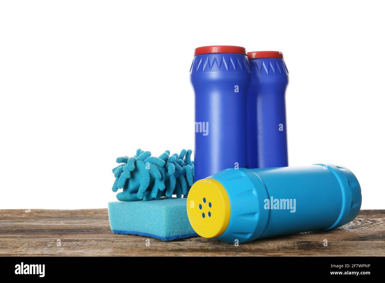 Set of cleaning supplies on wooden table against white background Stock ...