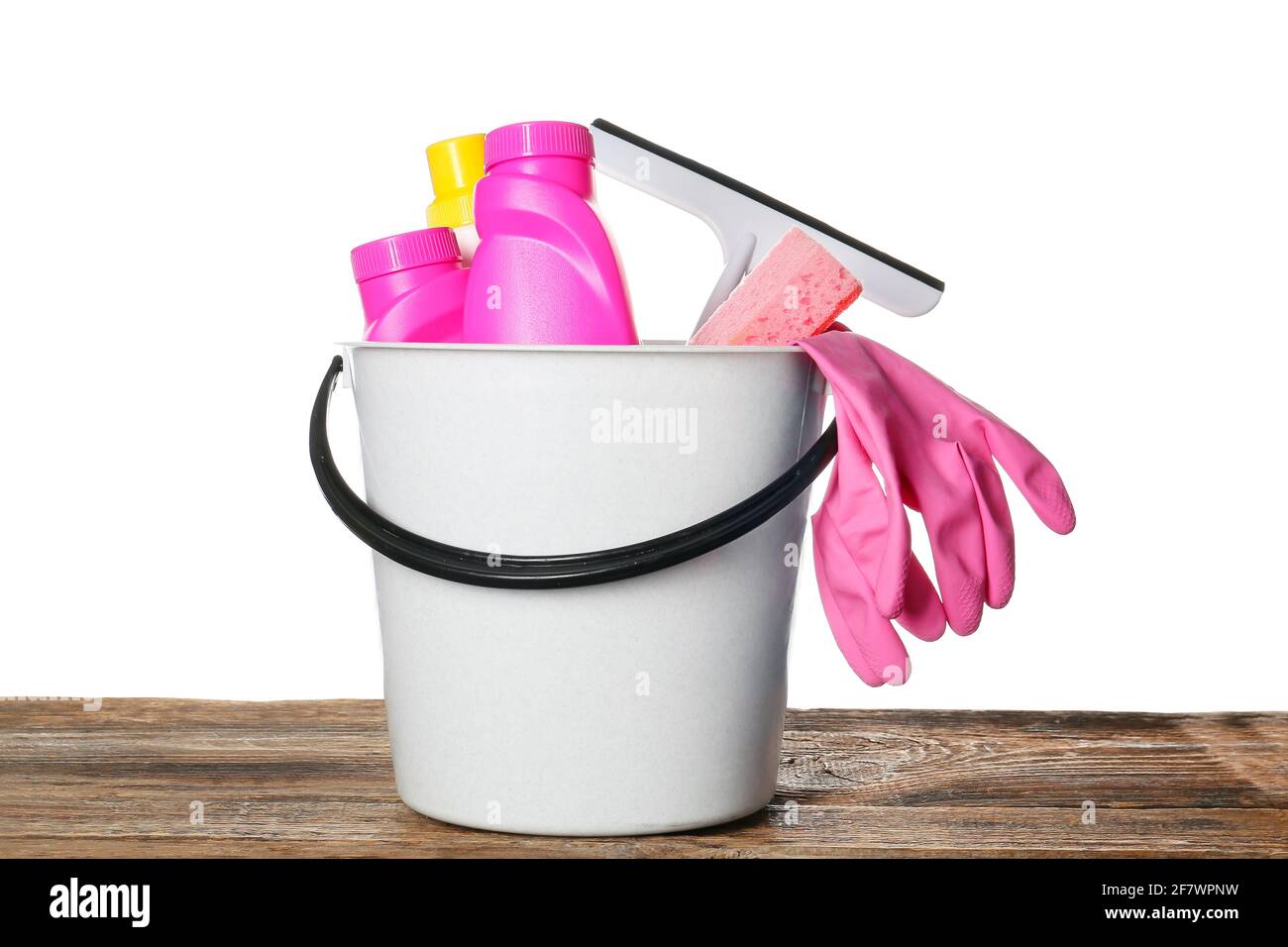 Set of cleaning supplies on wooden table against white background Stock ...
