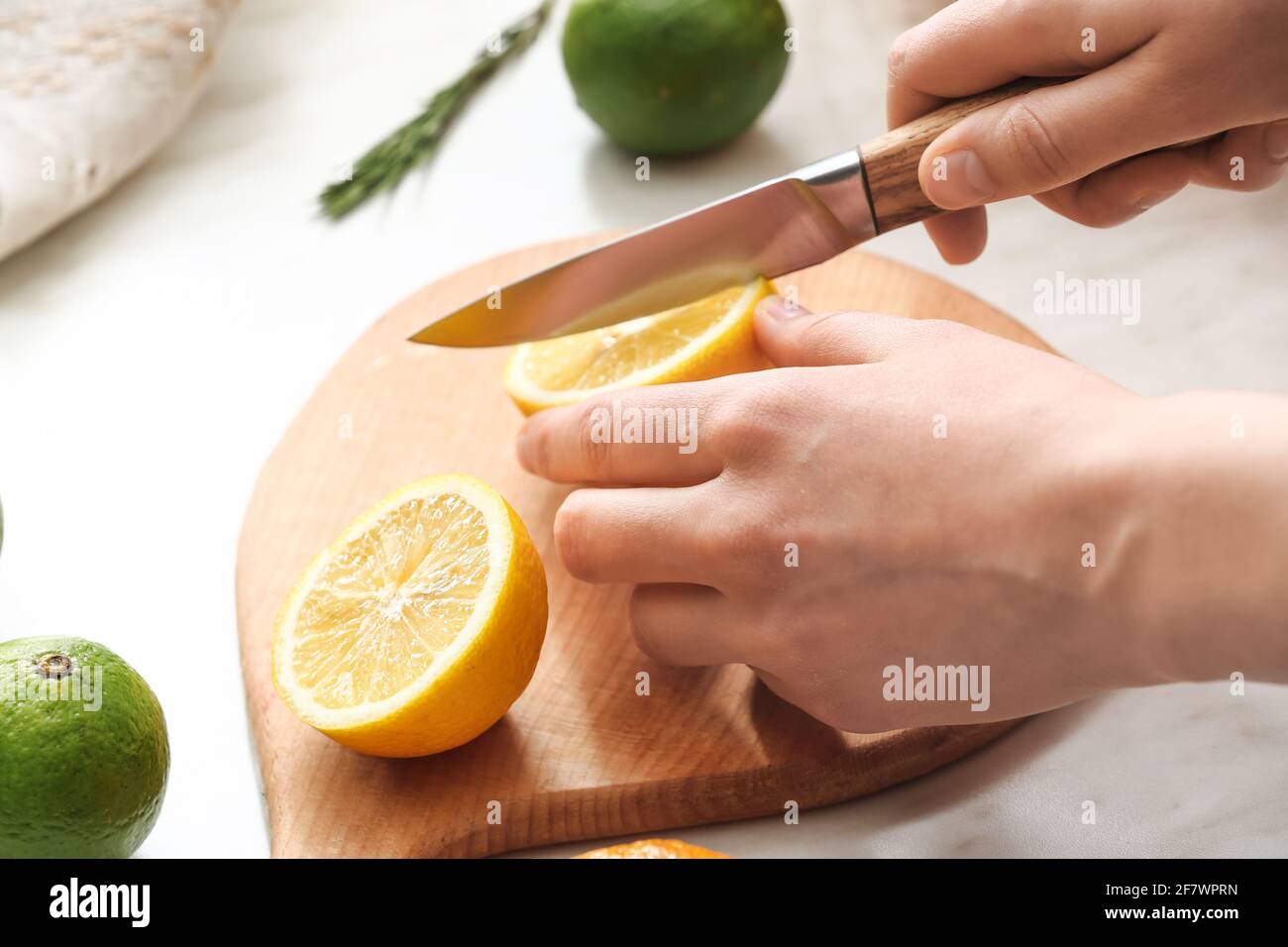 Woman cutting lemon on hi-res stock photography and images - Alamy